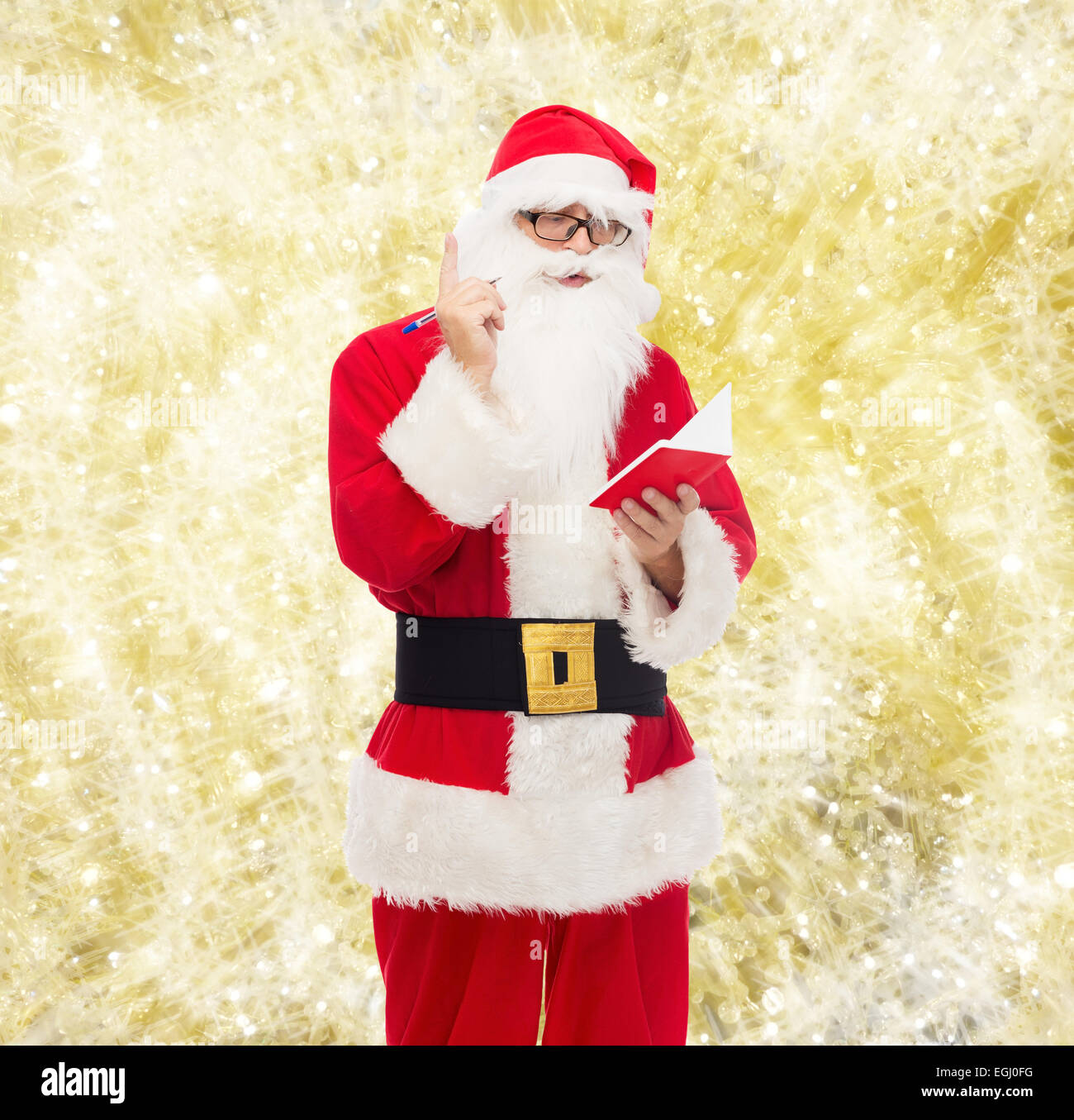 man in costume of santa claus with notepad Stock Photo - Alamy
