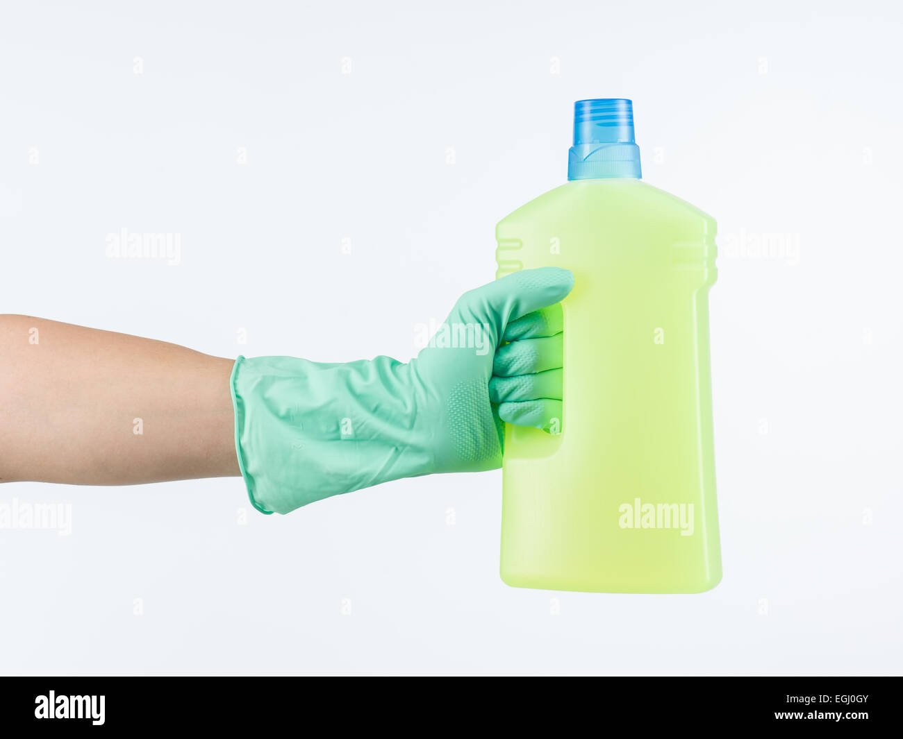 human hand wearing protective rubber glove, holding plastic bottle with ...