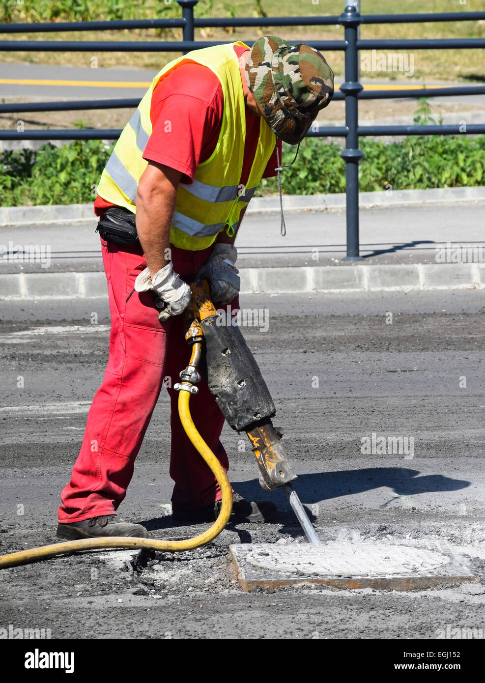 Man is working at the road construction Stock Photo - Alamy