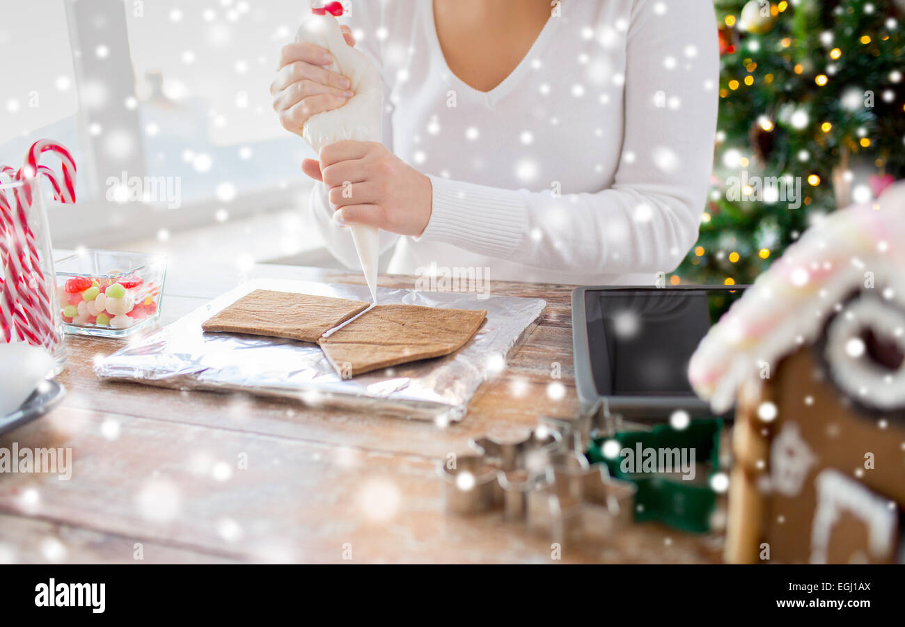 close up of woman making gingerbread houses Stock Photo - Alamy