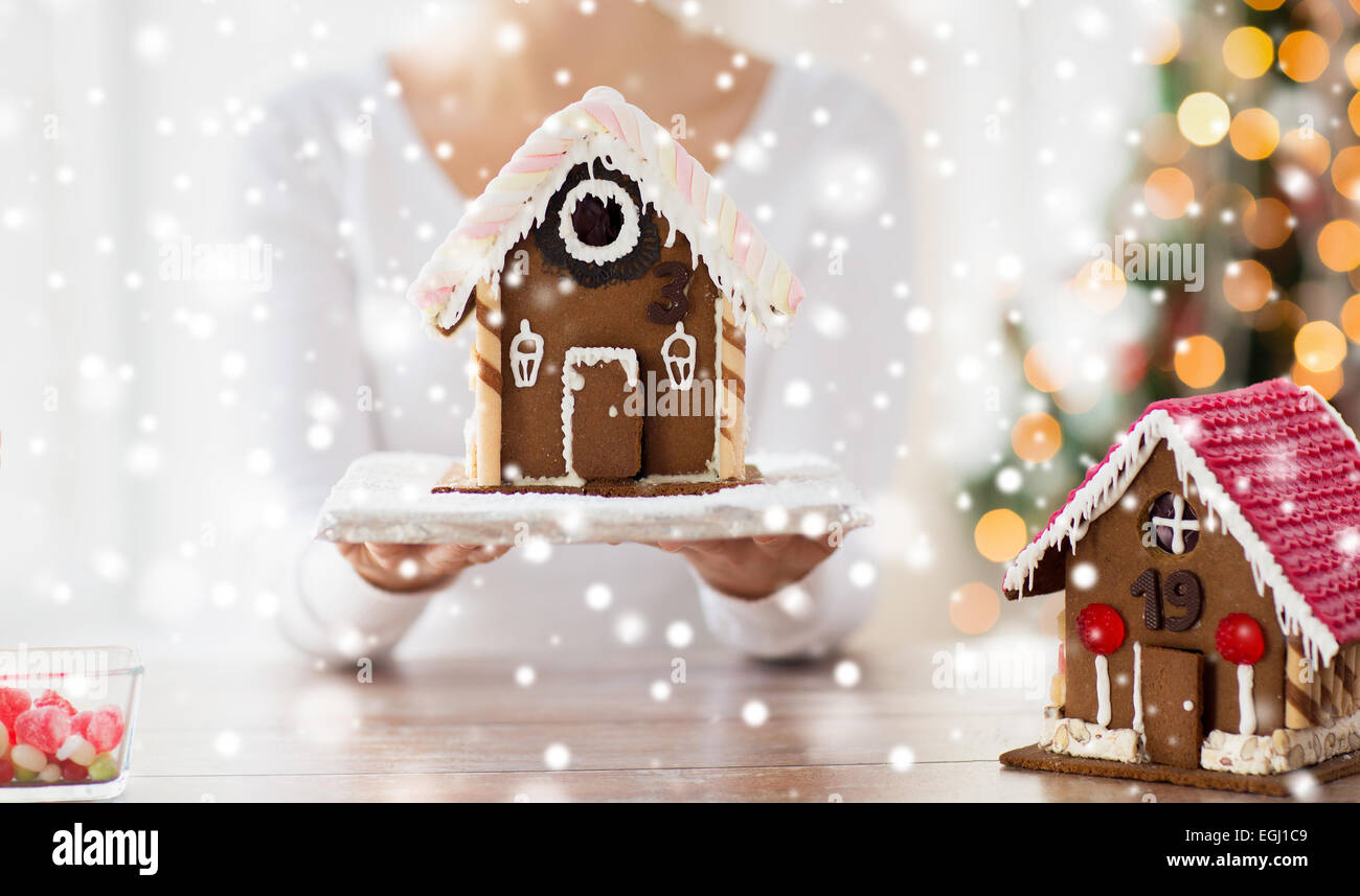 close up of woman showing gingerbread house Stock Photo - Alamy