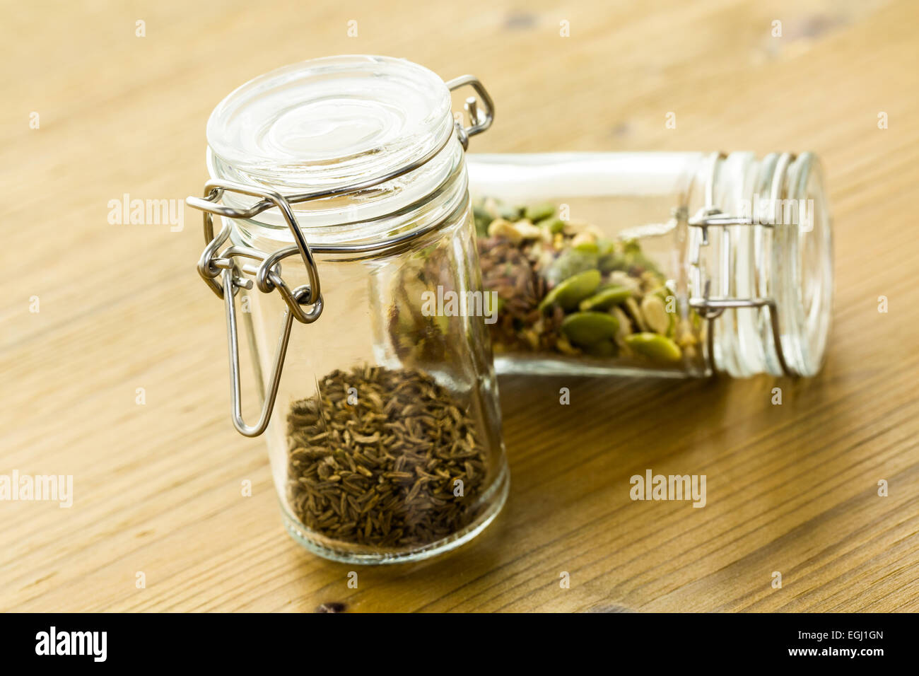 Dry seeds for baking bread in small glass jars Stock Photo - Alamy