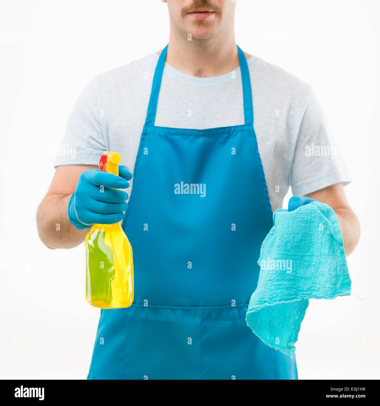 close-up of caucasian male wearing apron, holding cleaning spray bottle ...