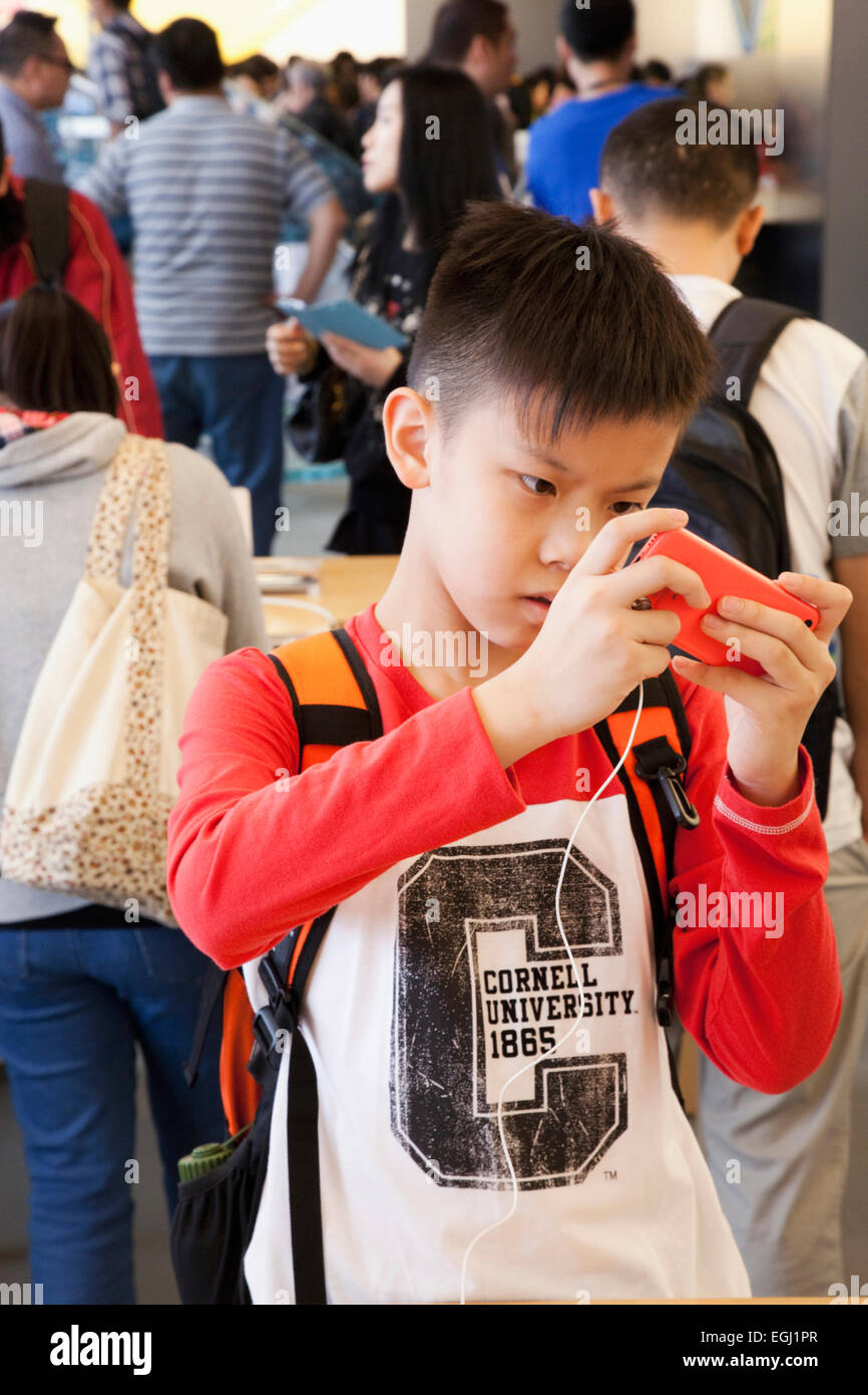 Children playing iphones hi-res stock photography and images - Alamy