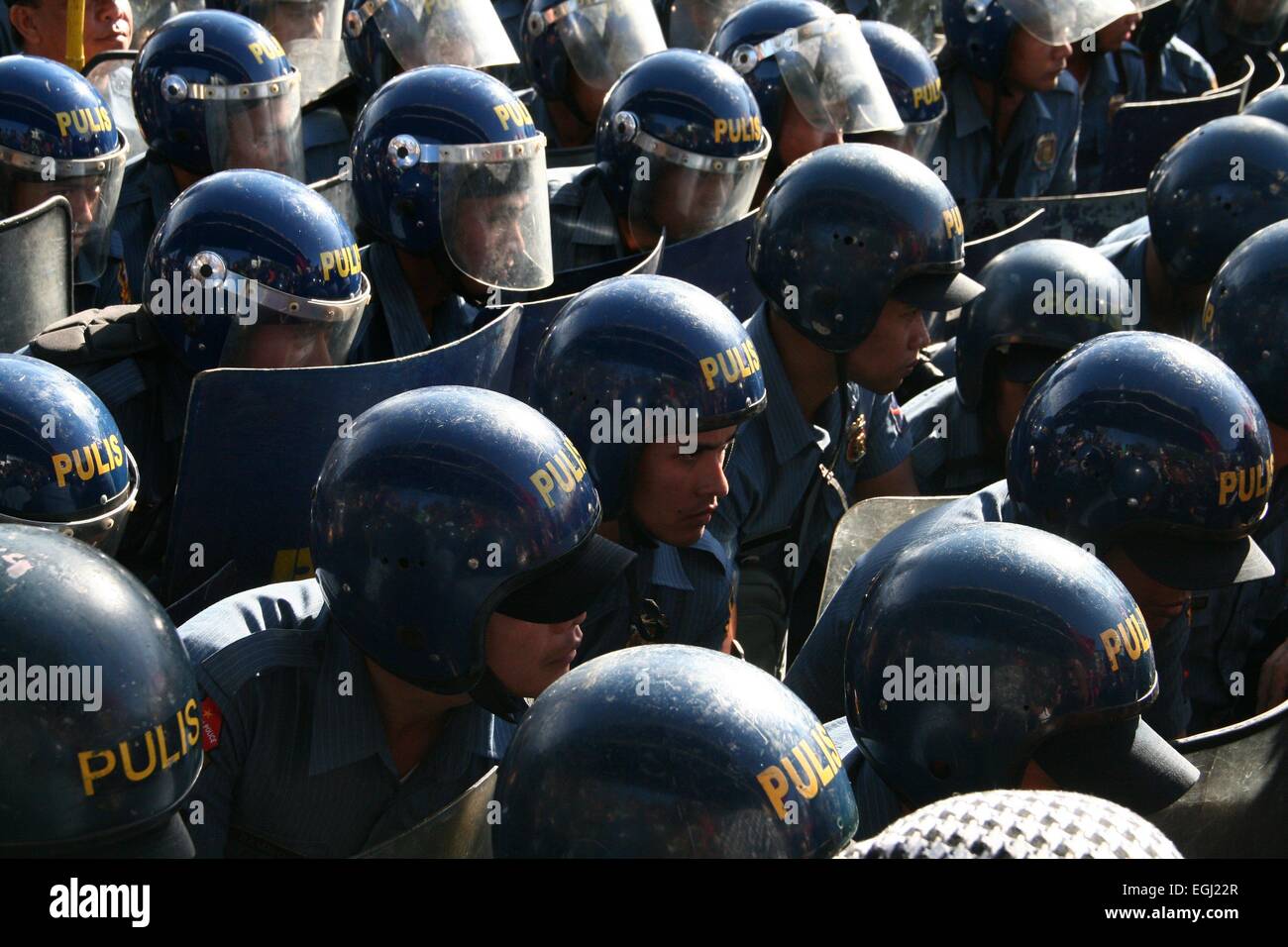Crowd control police officers hold their position as protesters ...