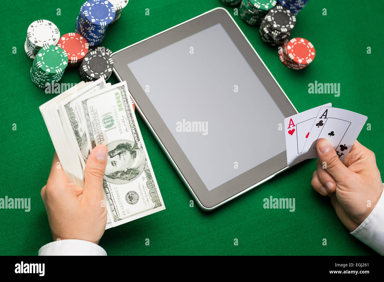 casino poker player with cards, tablet and chips Stock Photo - Alamy