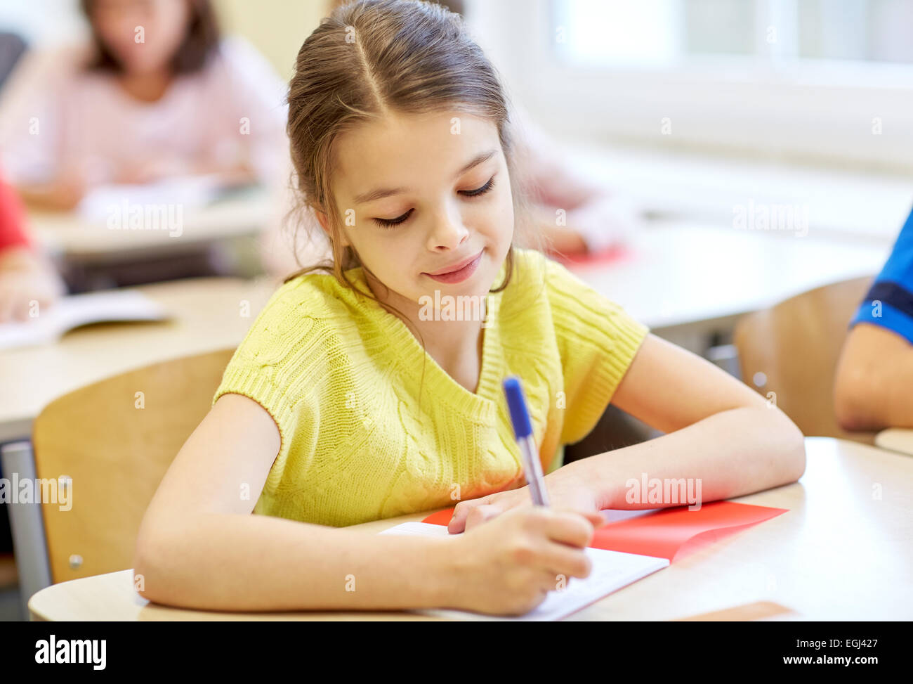 group of school kids writing test in classroom Stock Photo - Alamy