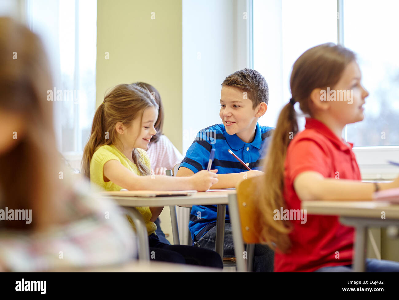 group of school kids writing test in classroom Stock Photo - Alamy