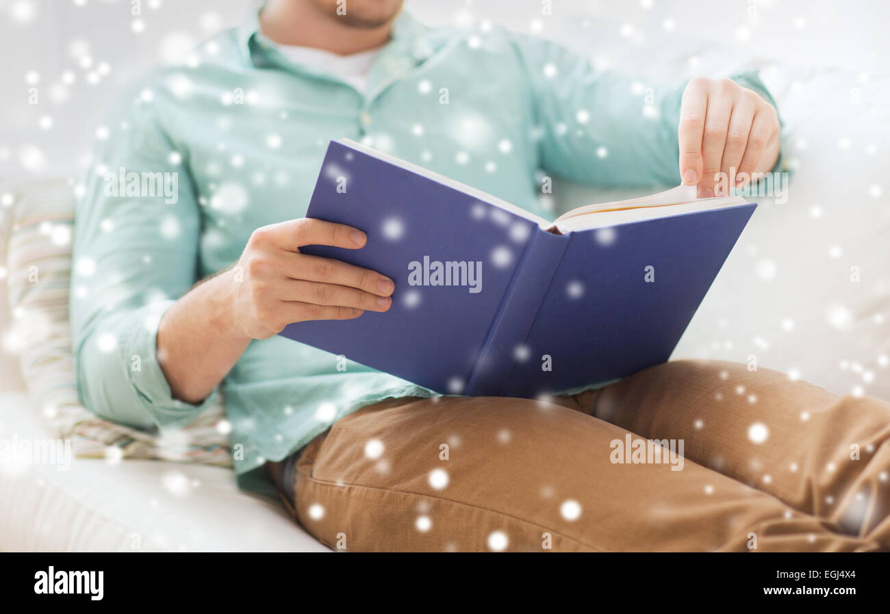 close up of man reading book at home Stock Photo - Alamy
