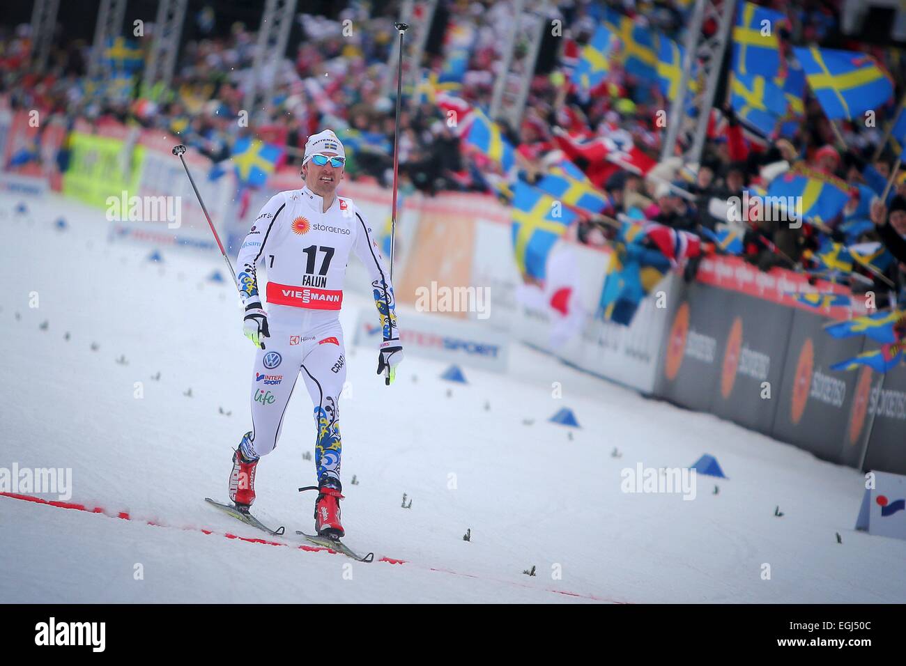Johan Olsson of Sweden crosses the finish line to win the cross country ...
