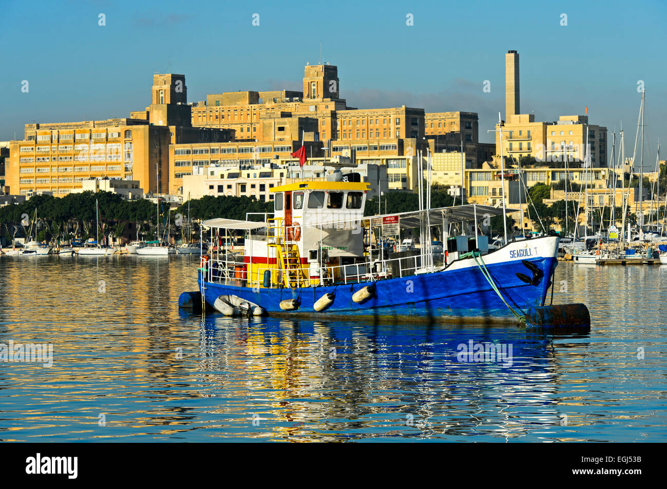 St. Luke Hospital at the harbour, boat at the front, Marsamxett ...