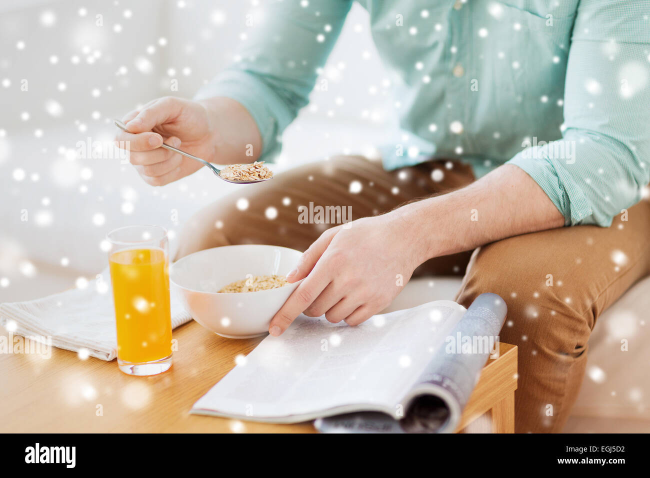 close up of man with magazine eating breakfast Stock Photo - Alamy