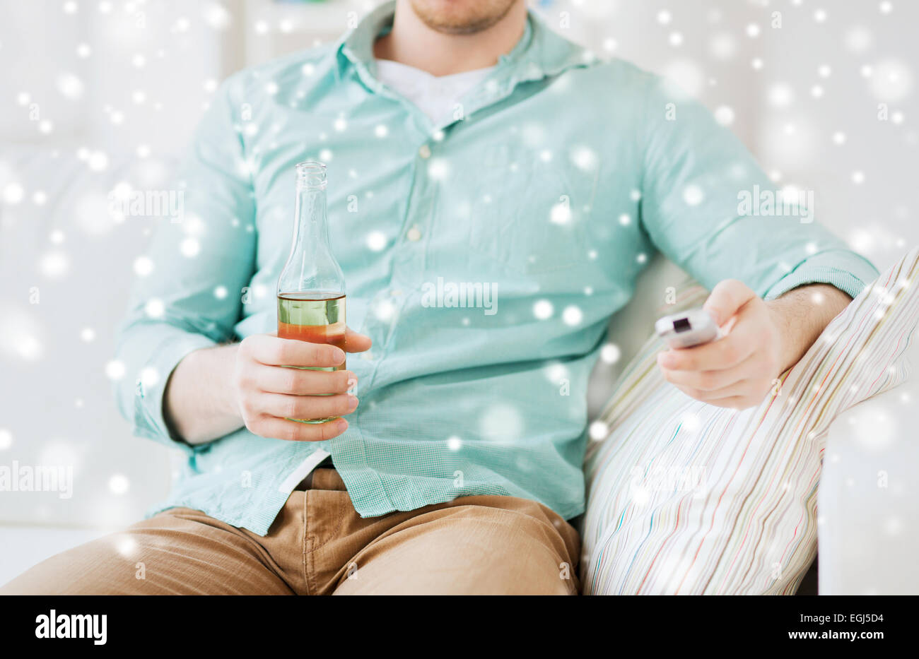 man with beer and remote control at home Stock Photo - Alamy