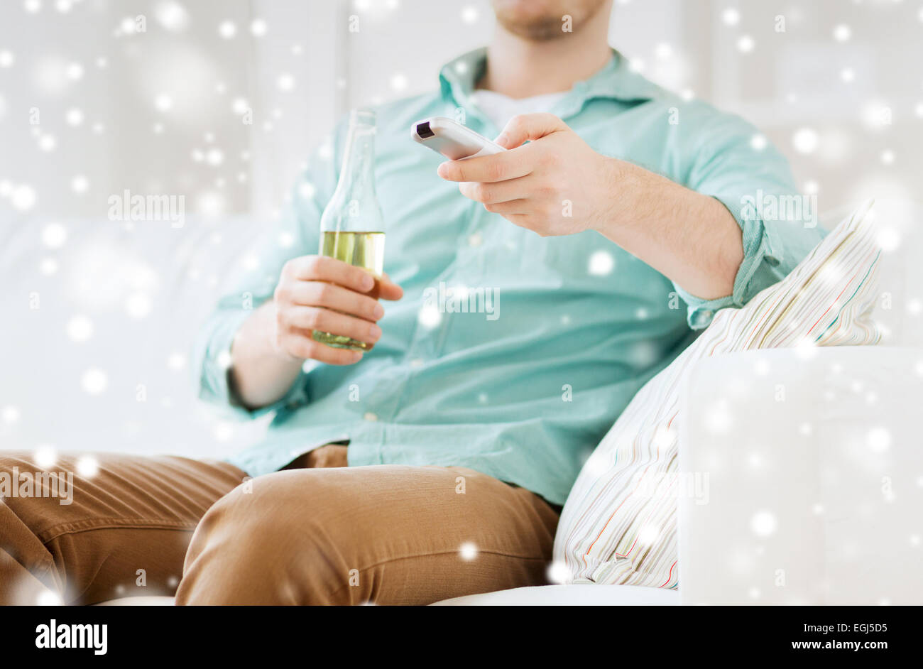 man with beer and remote control at home Stock Photo - Alamy