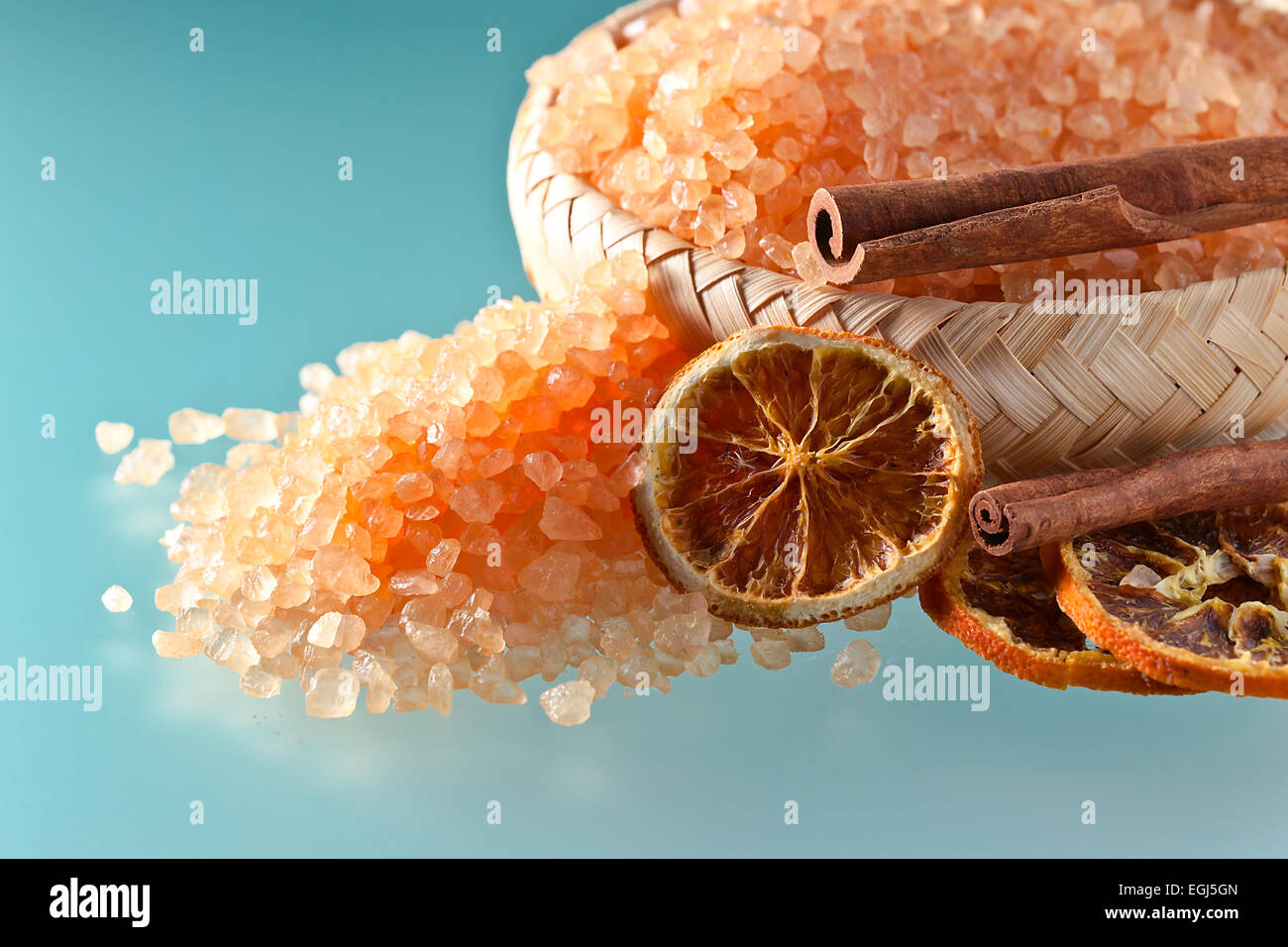 Sea salt with dried oranges and cinnamon sticks on glass table Stock ...