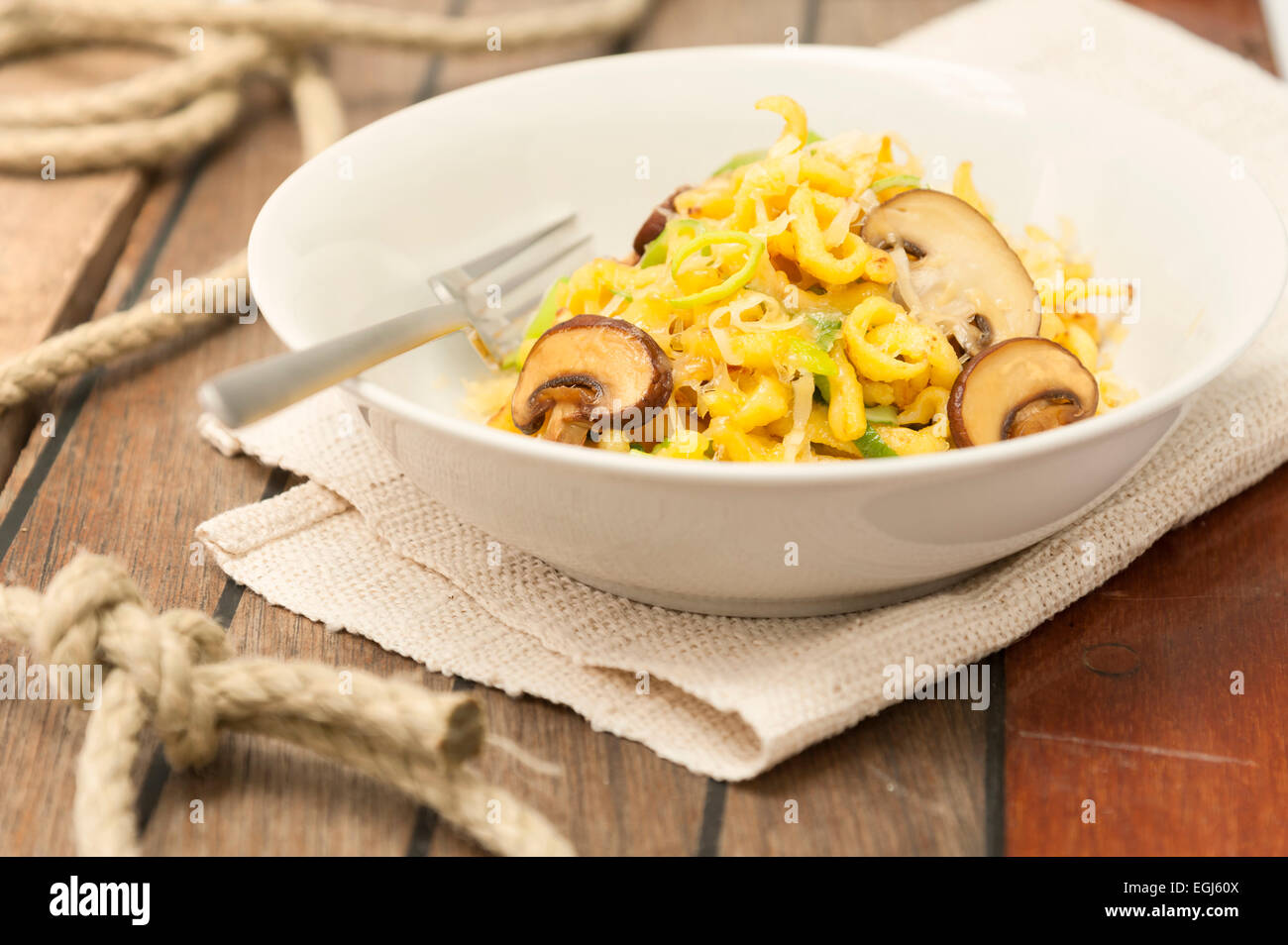spaetzle, mushrooms, leek, cheese, plate, teak deck Stock Photo - Alamy