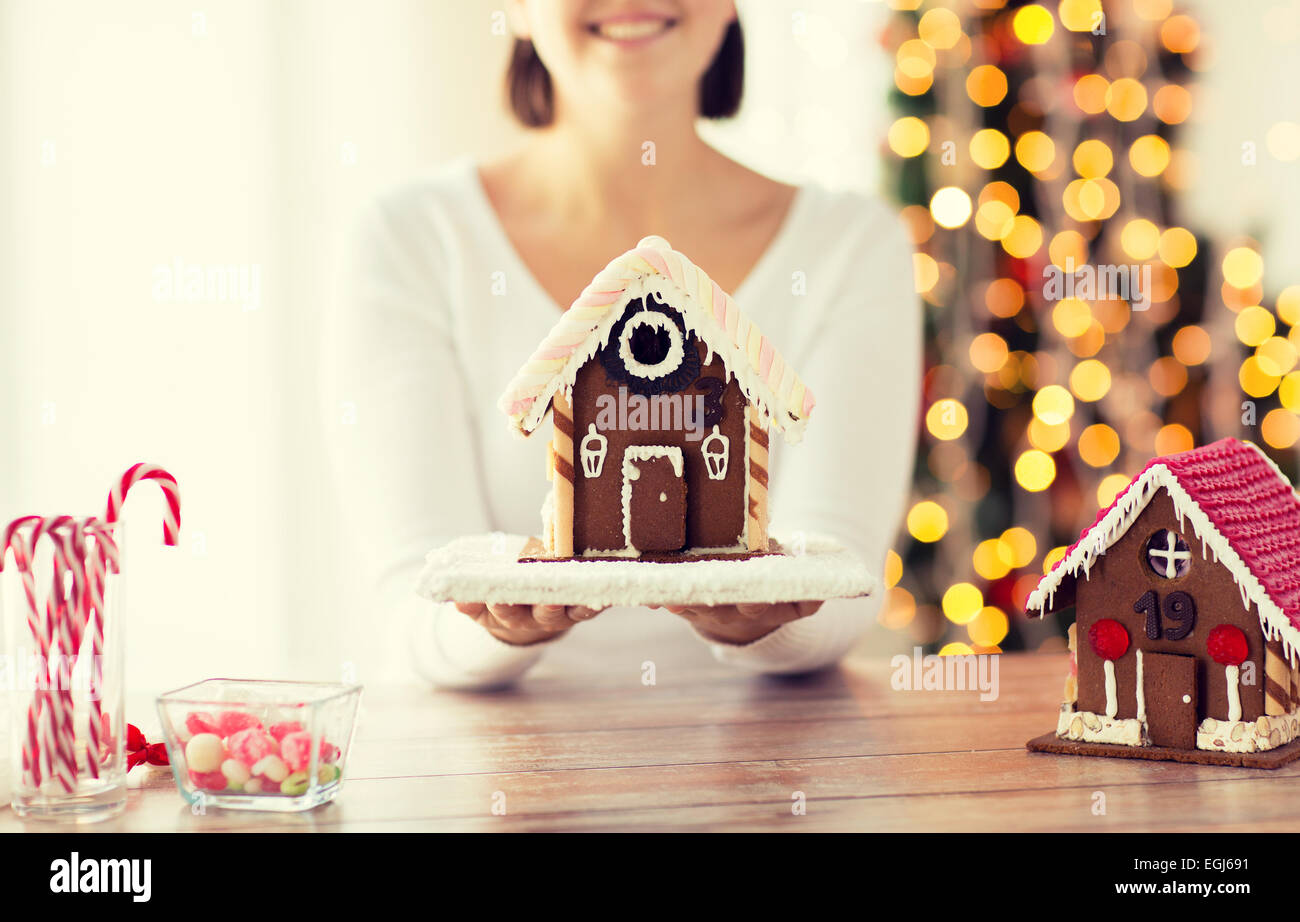 close up of woman showing gingerbread house Stock Photo - Alamy