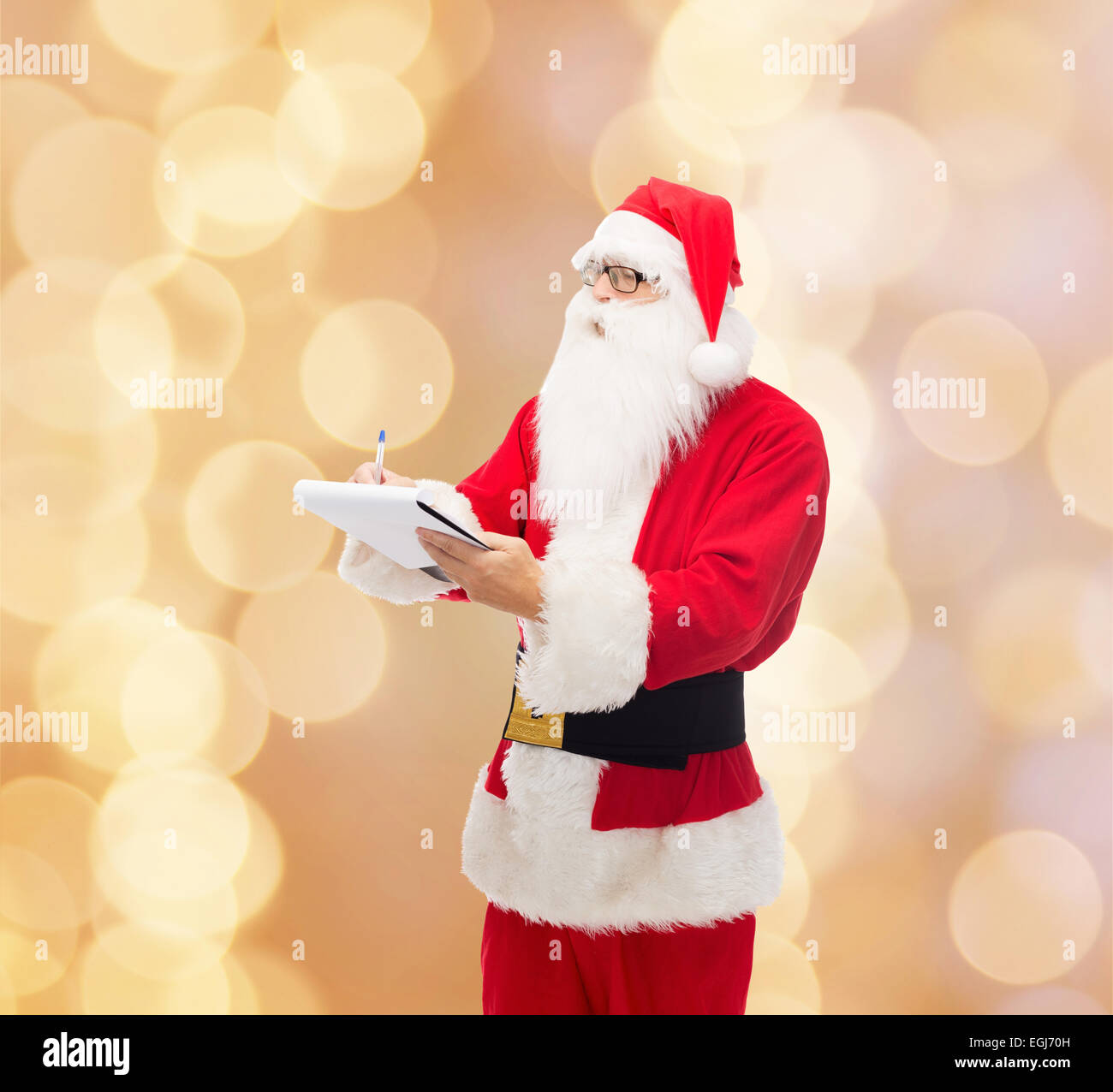 man in costume of santa claus with notepad Stock Photo - Alamy