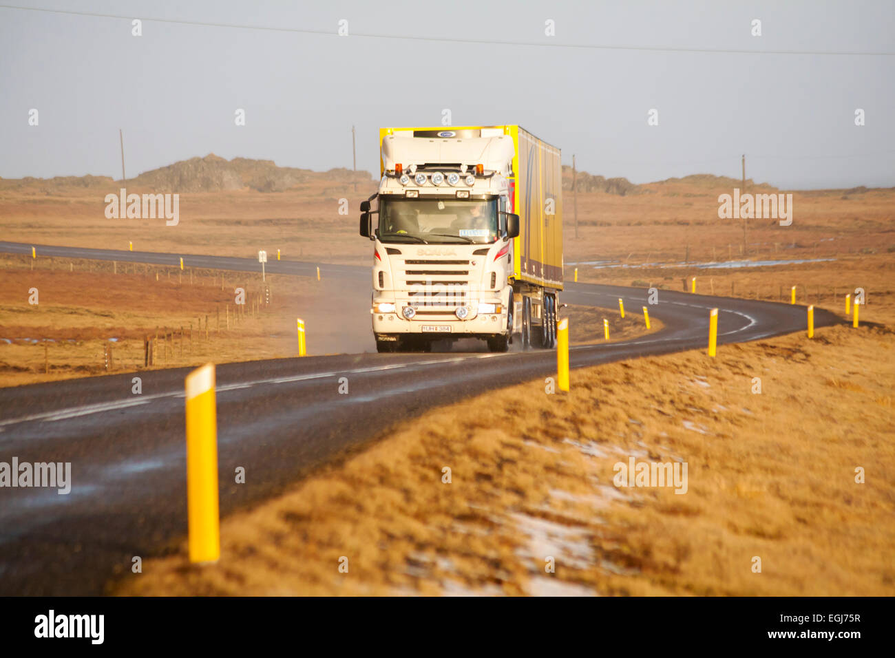 Scania juggernaut travelling along roads in Kambsnes, East Iceland in ...