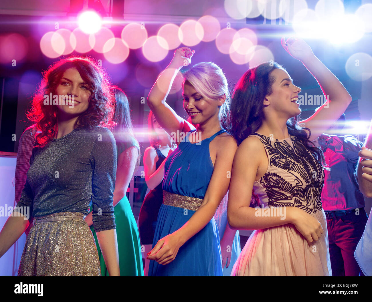 smiling friends dancing in club Stock Photo - Alamy