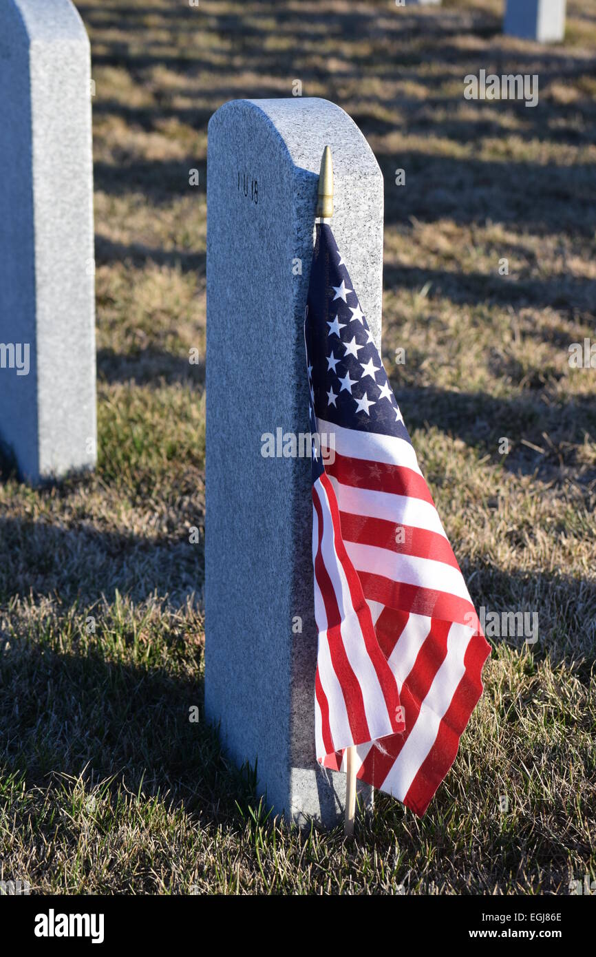 Flag by tombstone Stock Photo - Alamy
