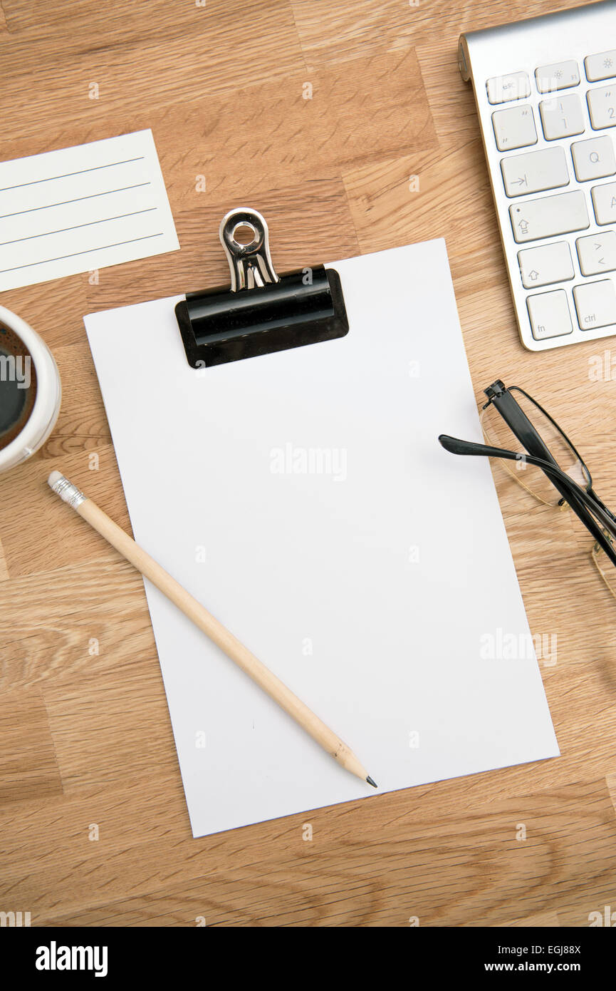 Blank paper on the office table Stock Photo - Alamy