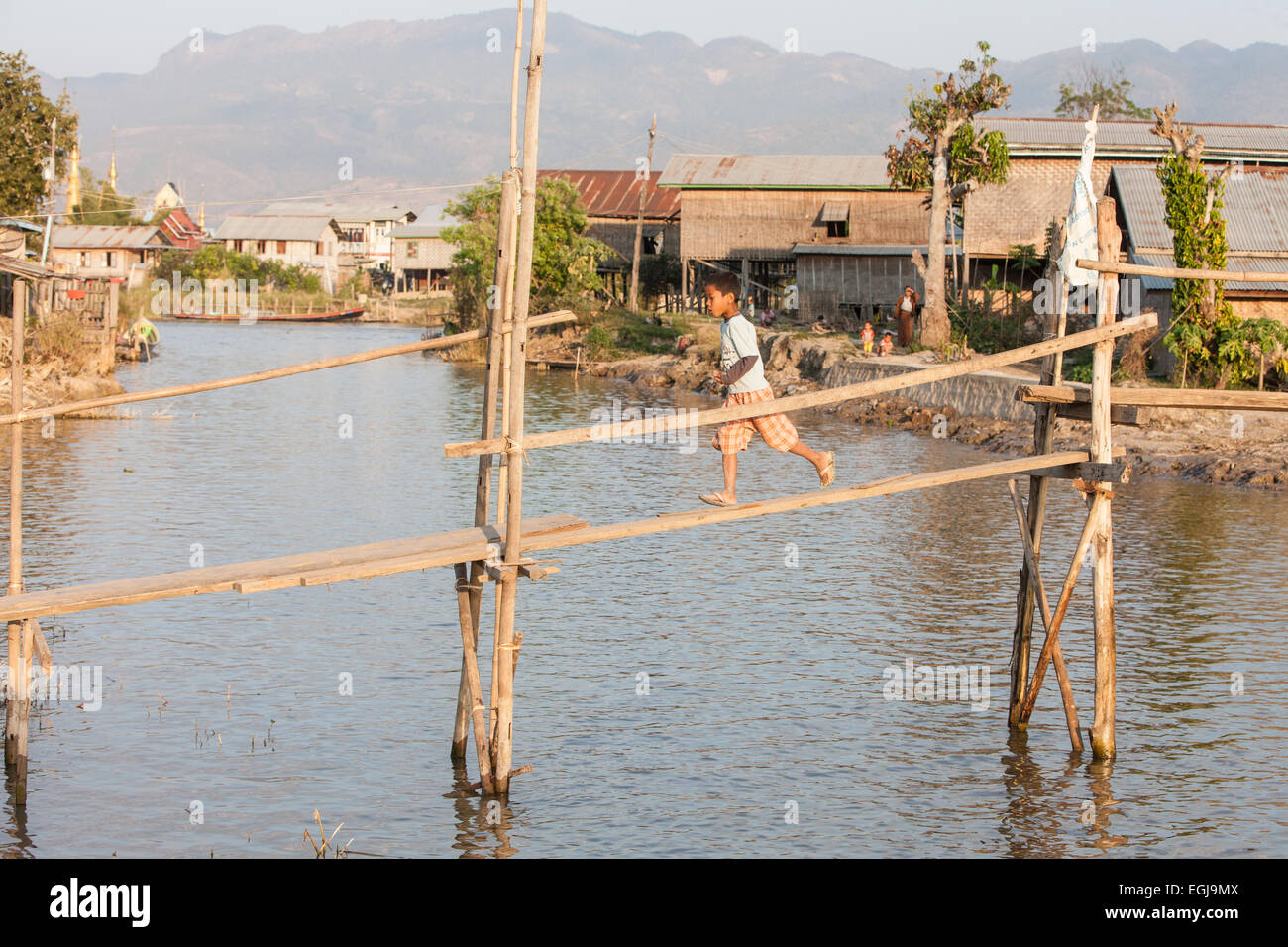 Crossing over waterway,canal at Inle Lake,on a bridge of basic ...