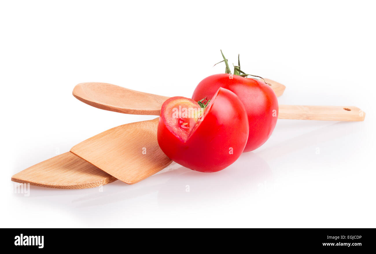 wooden spoon and red tomato isolated on white background Stock Photo ...