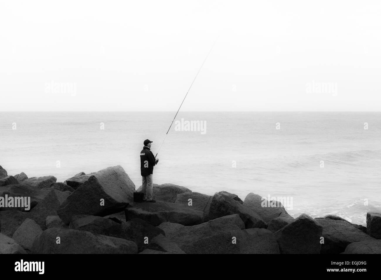 Silhouette of man fishing Black and White Stock Photos & Images - Alamy