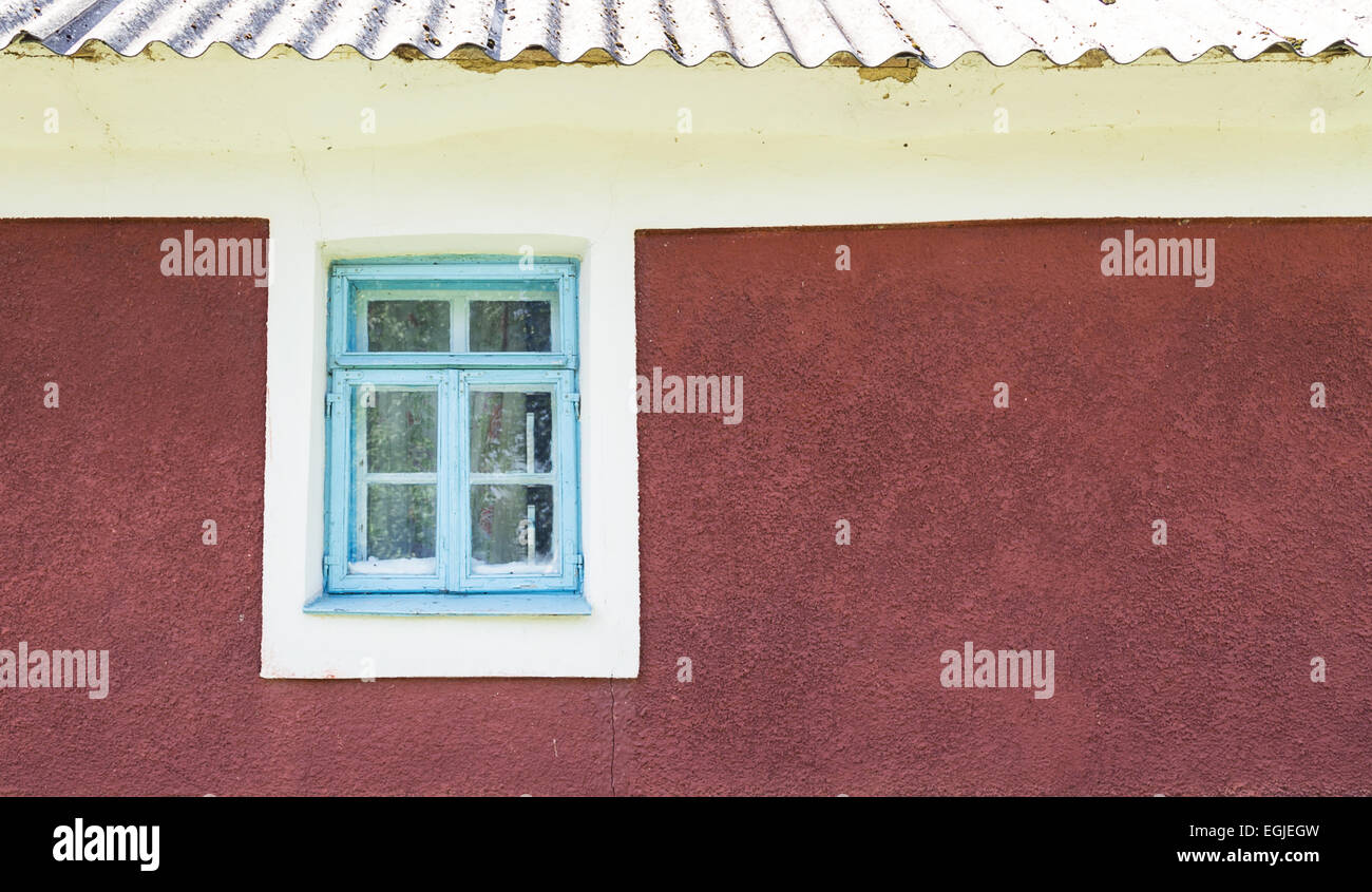 old blue window on red wall Stock Photo - Alamy