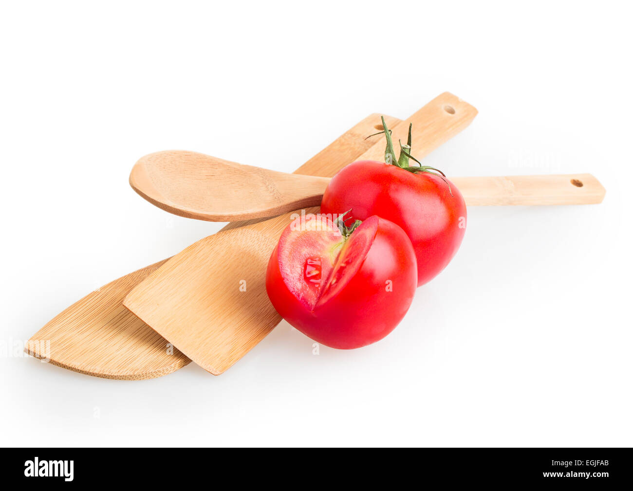 wooden spoon and red tomato isolated on white background Stock Photo ...