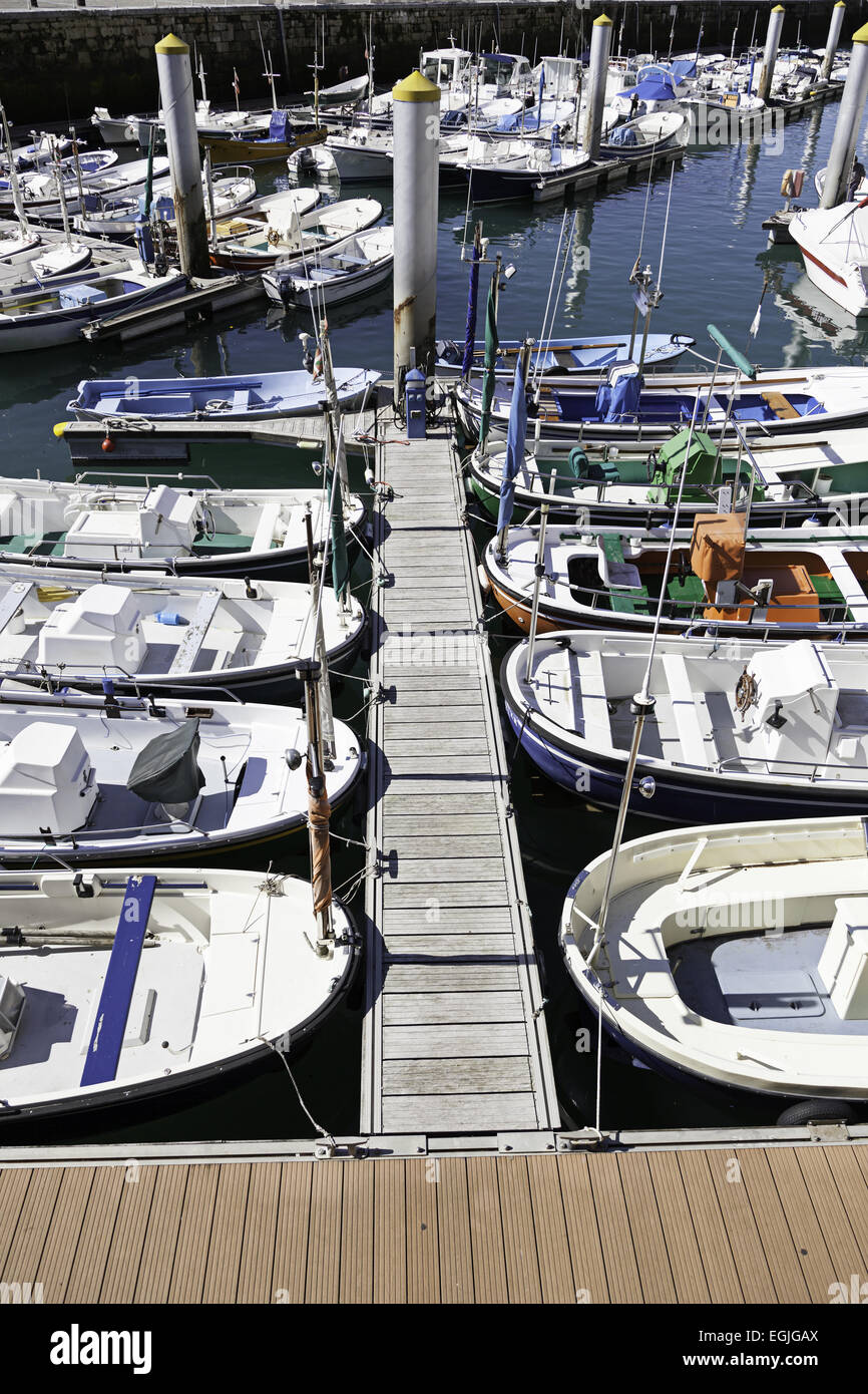 Boats moored at a marine dock, detail of recreational boats on a dock ...