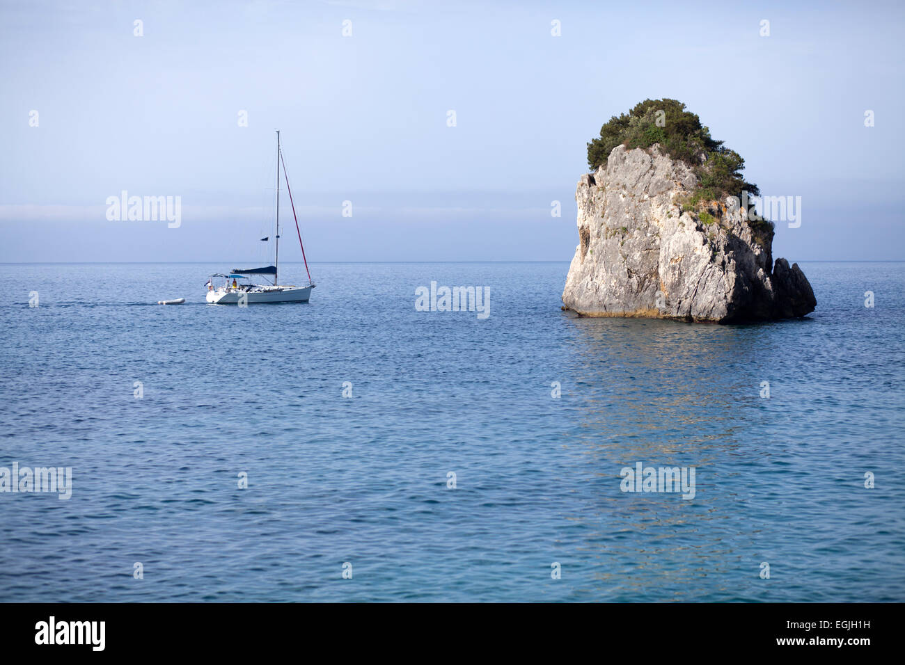 Beautiful coastline view with small boat Stock Photo - Alamy