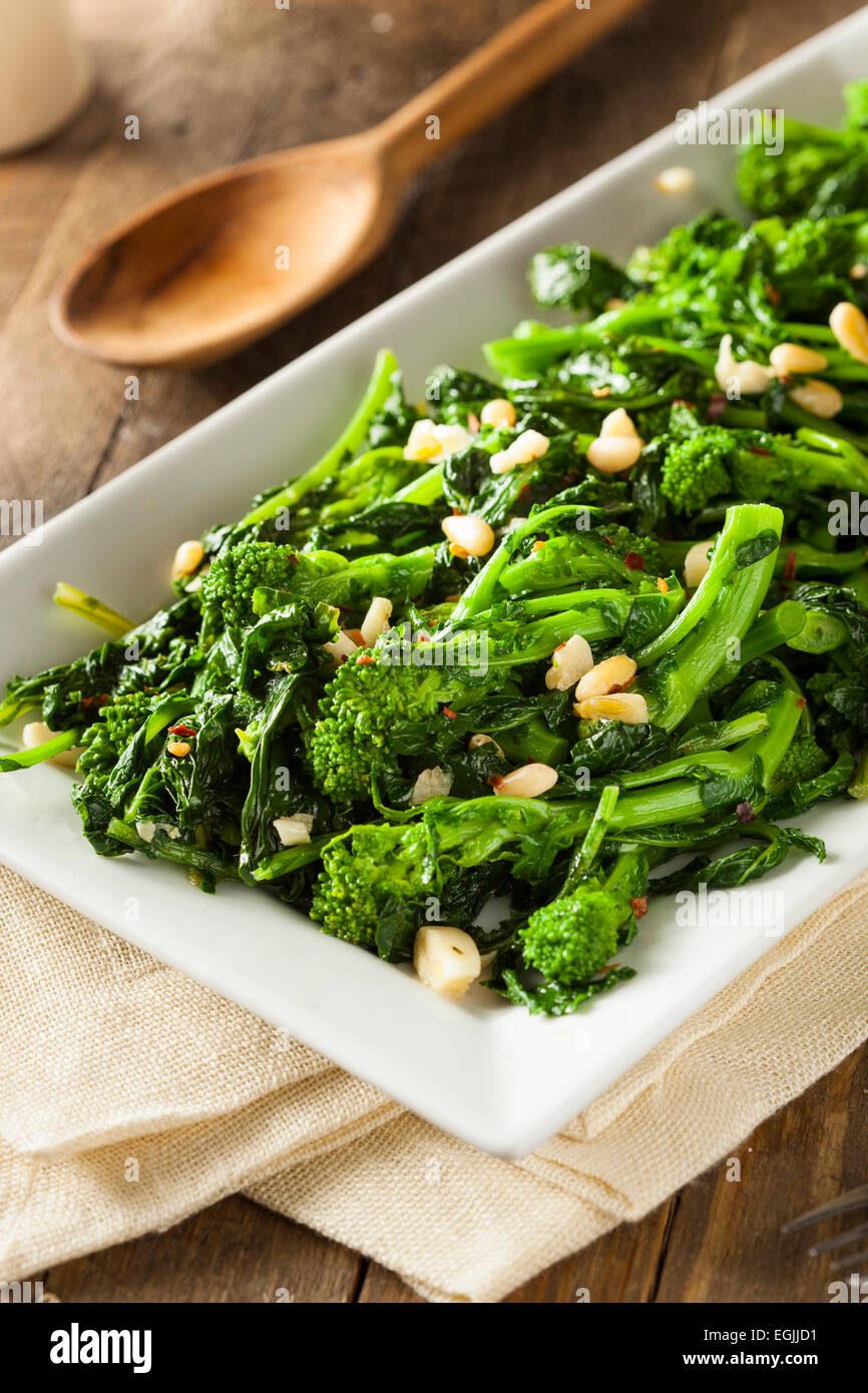 Homemade Sauteed Green Broccoli Rabe with Garlic and Nuts Stock Photo ...