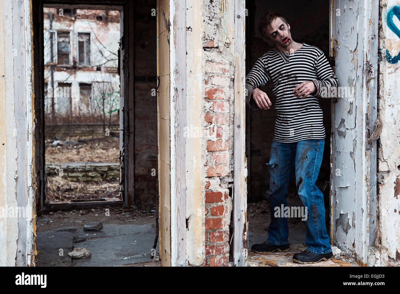 Bleeding young man with white spooky eyes Stock Photo - Alamy