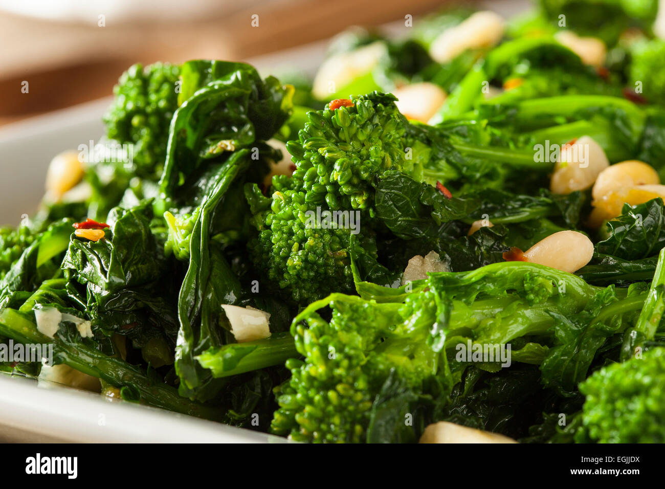 Homemade Sauteed Green Broccoli Rabe with Garlic and Nuts Stock Photo ...