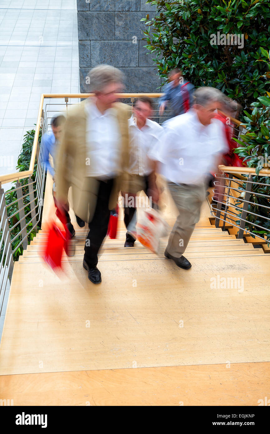 Office worker walking up stairs, motion blur Stock Photo - Alamy
