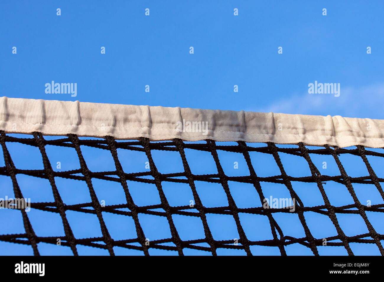 Tennis court net and blue sky in the background Stock Photo - Alamy