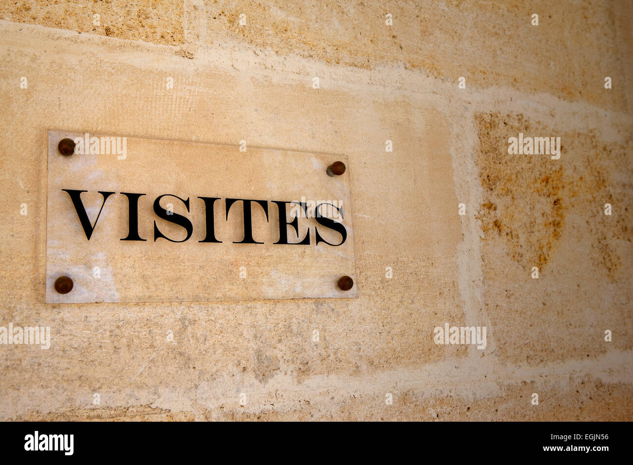 Visit sign on a stoned wall of a monument Stock Photo - Alamy