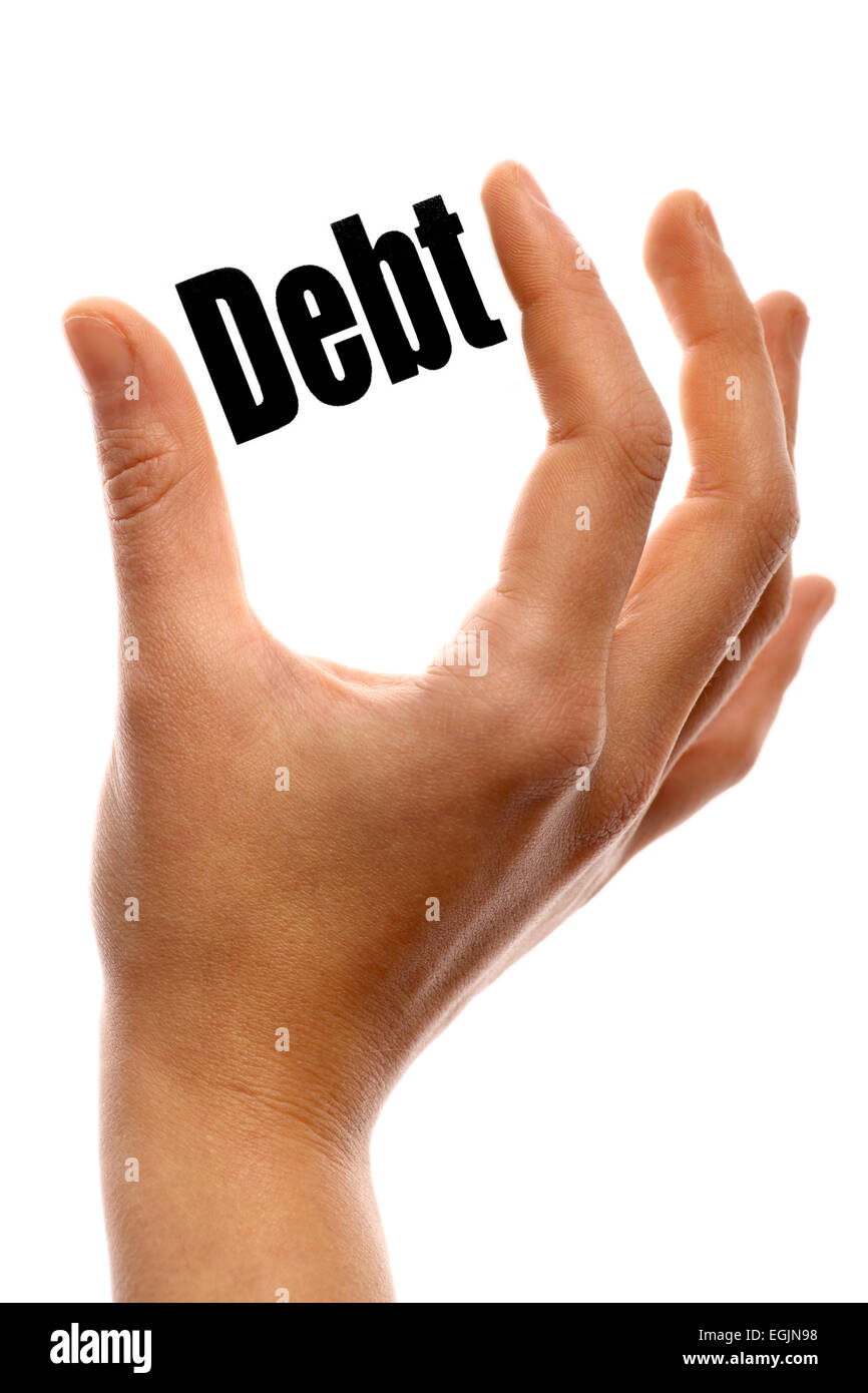 Vertical shot of a hand holding the word "Debt" between two fingers ...