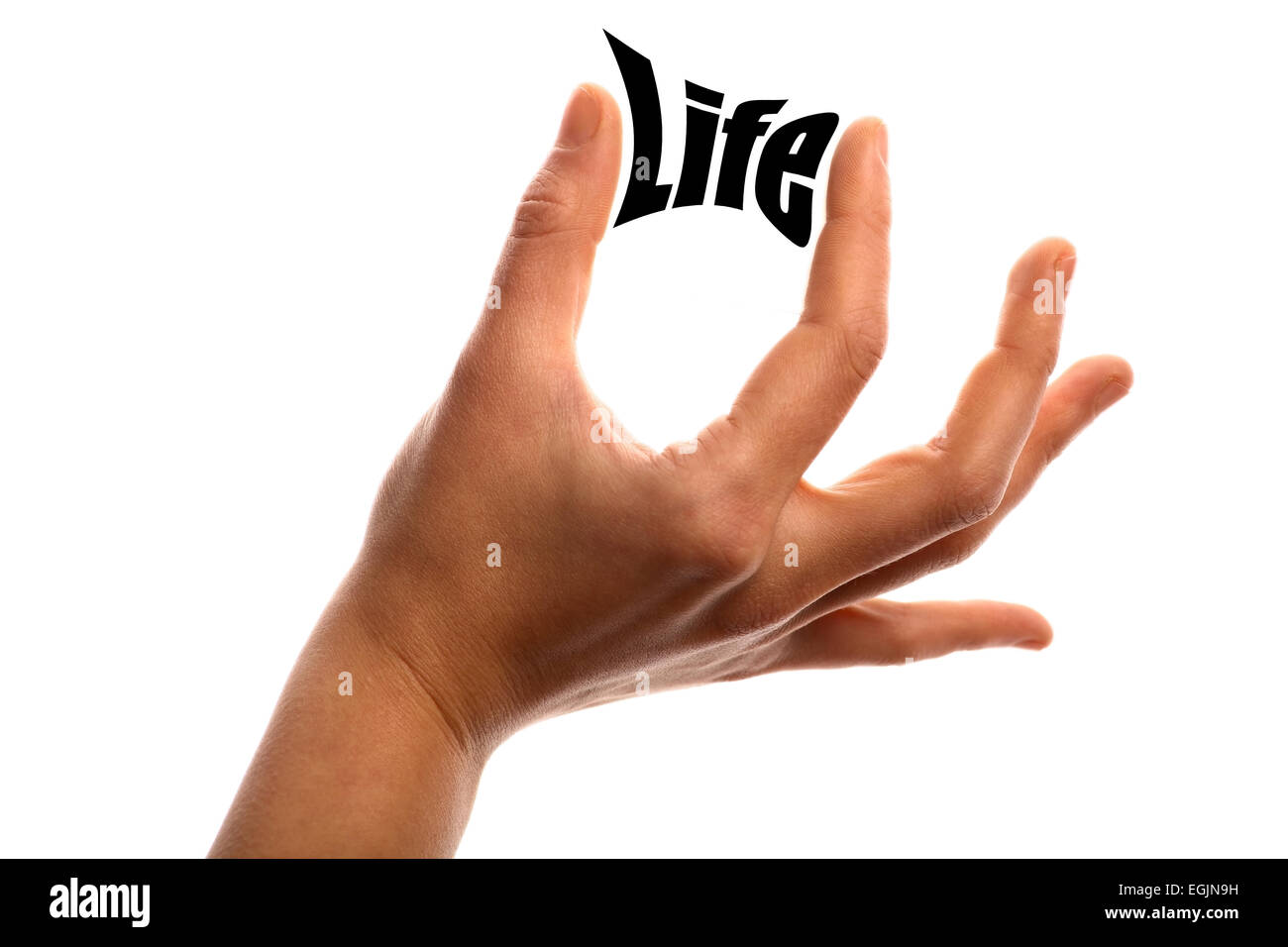 Horizontal shot of a hand holding the word "Life" between two fingers ...