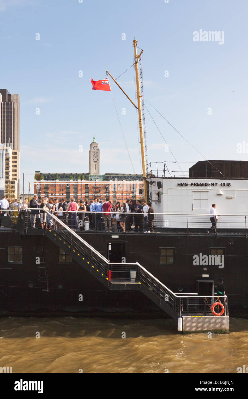 Poeple having a party on HMS President with Oxo Tower behind on the ...