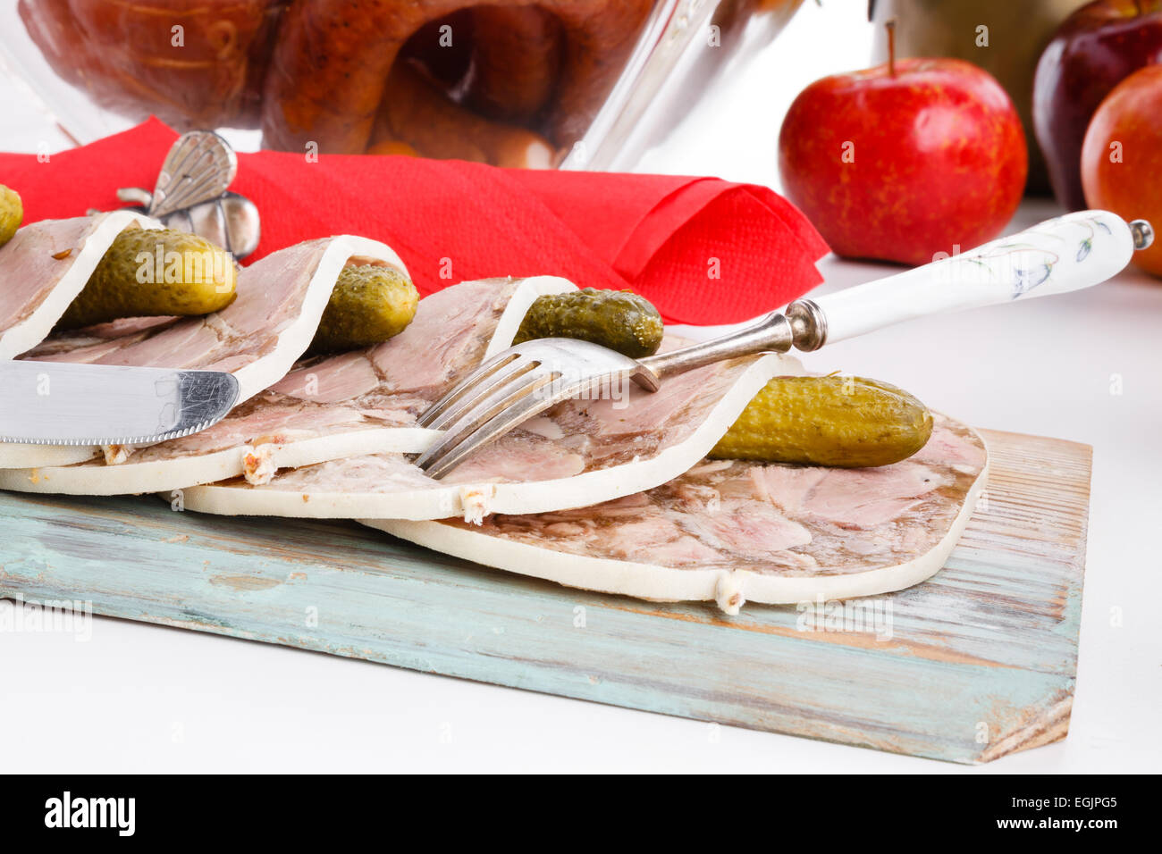 Black pudding sausage with pickled cocumber on blue kitchen board and ...