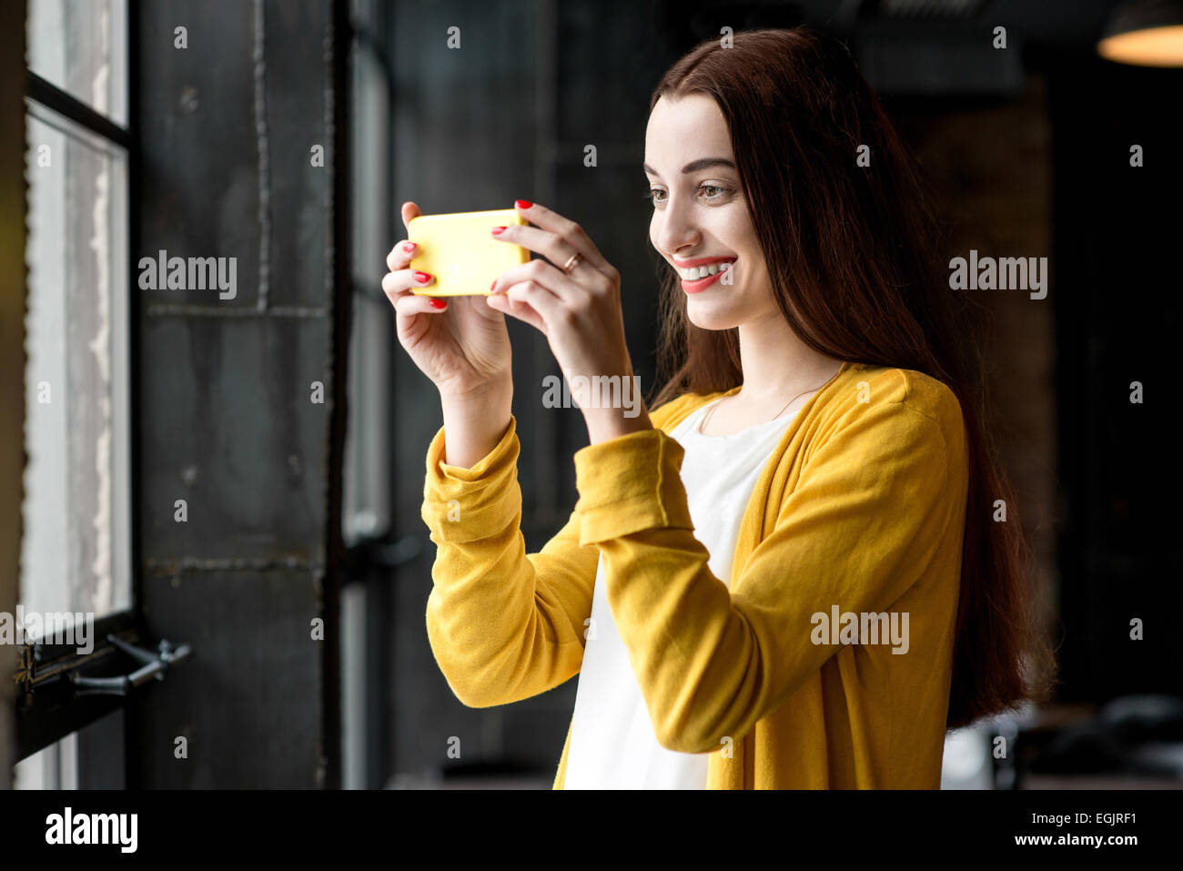 Woman using phone Stock Photo - Alamy