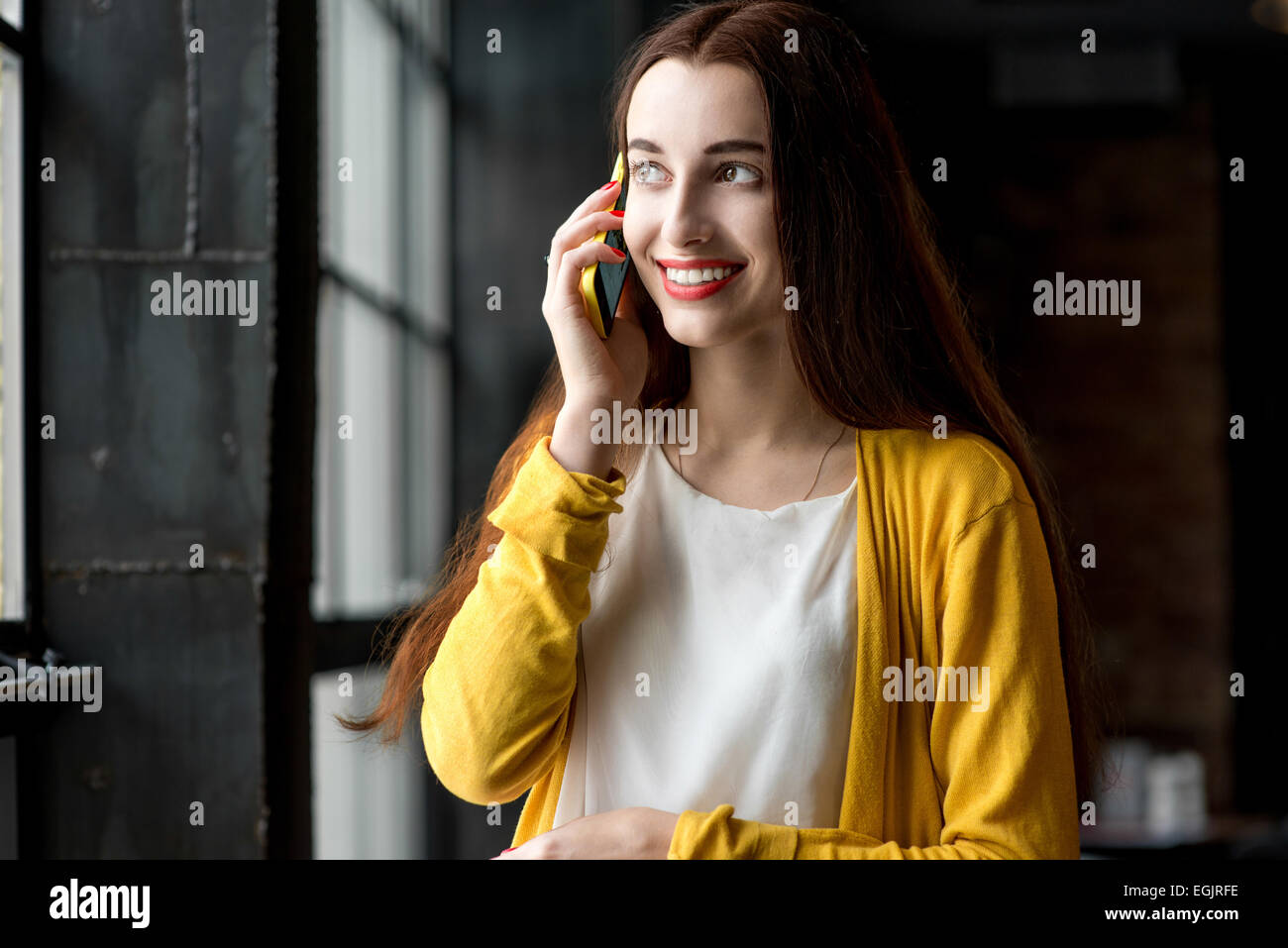 Woman using phone Stock Photo - Alamy