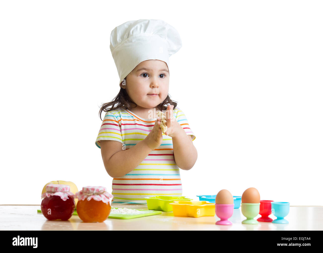 smiling baker kid girl in chef hat Stock Photo - Alamy
