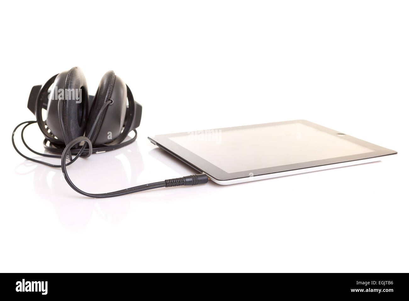 Headphones connected to a last generation tablet computer Stock Photo ...