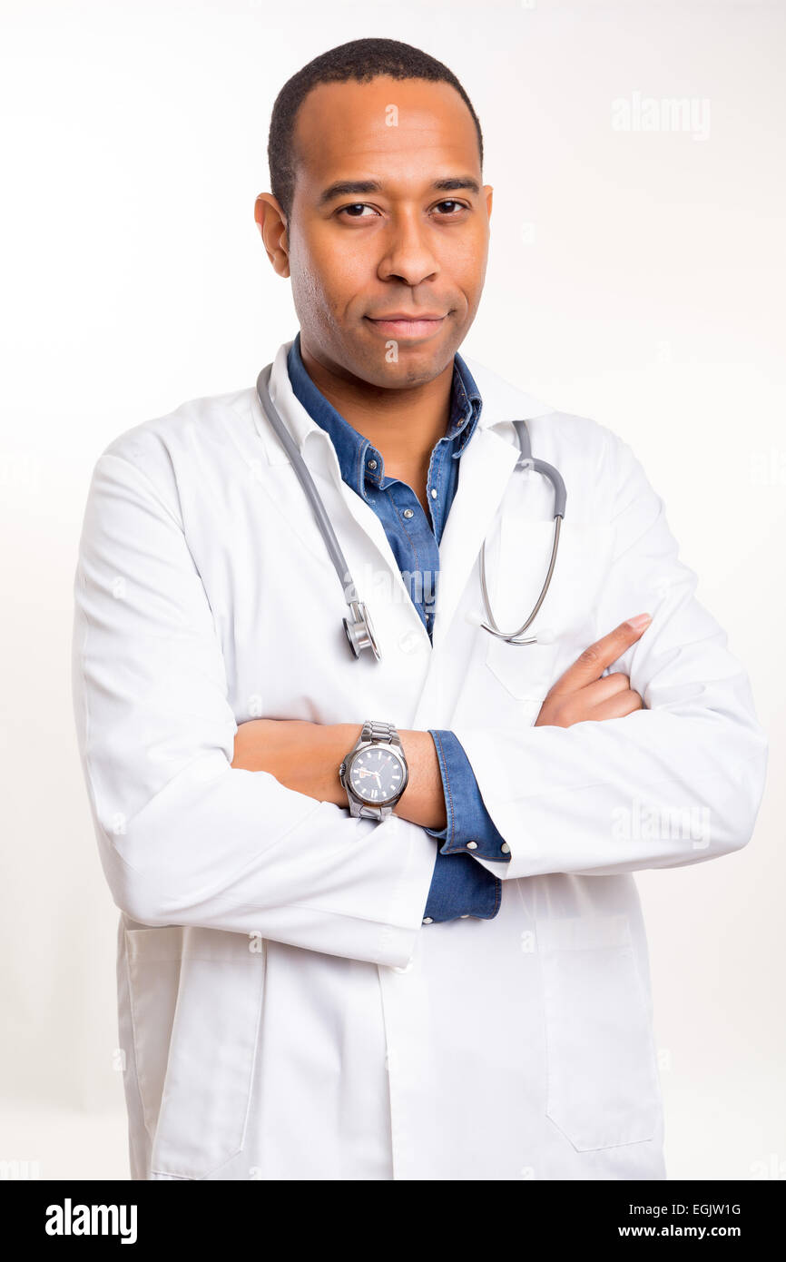 Handsome young african doctor posing isolated over a white background ...