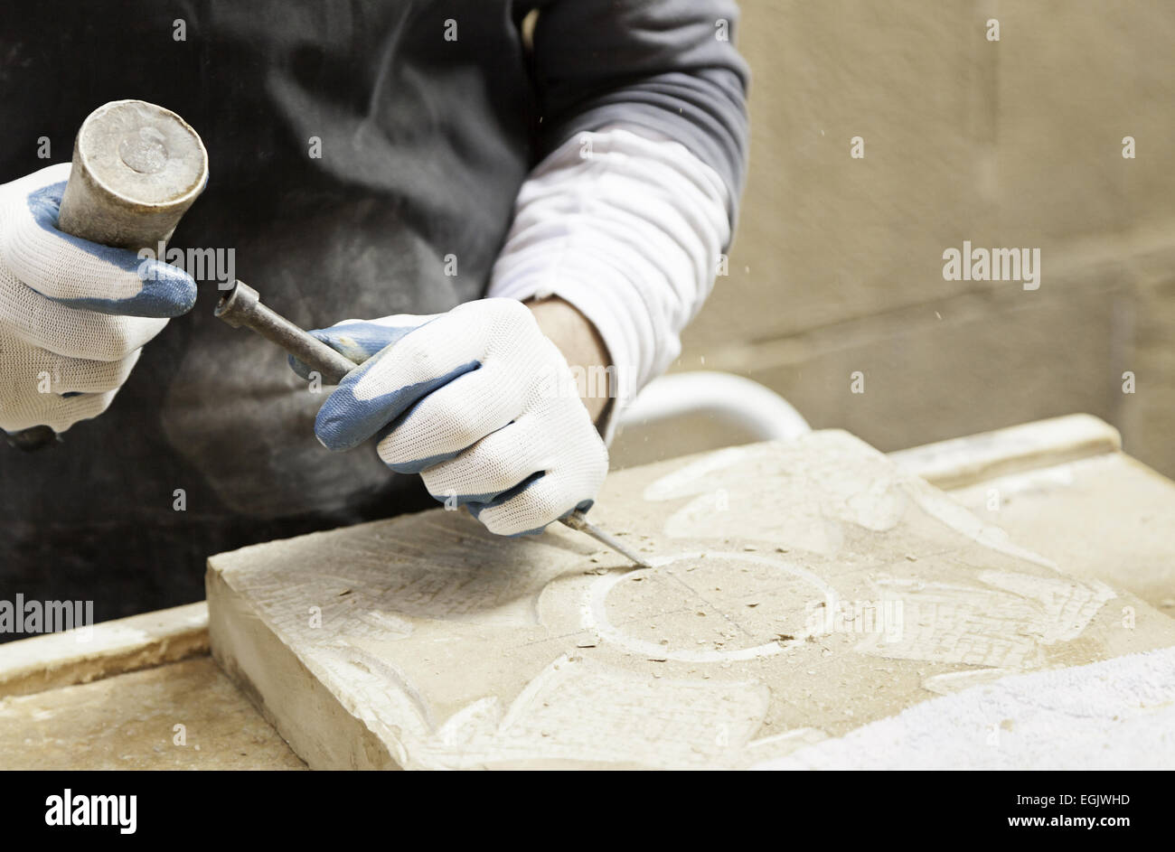 Man carving stone detail of a traditional craftsman working stone ...