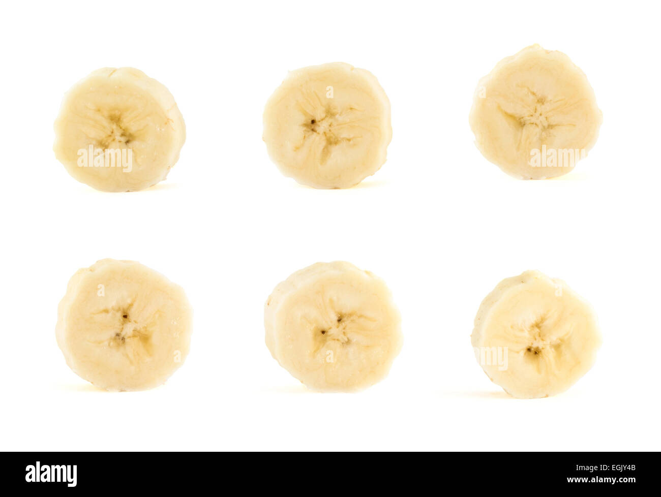 Six banana slices set over white background Stock Photo - Alamy